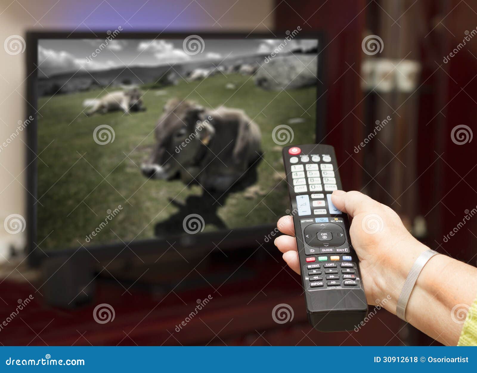 Hand Pointing a Tv Remote Control Towards the Television. Stock Photo ...