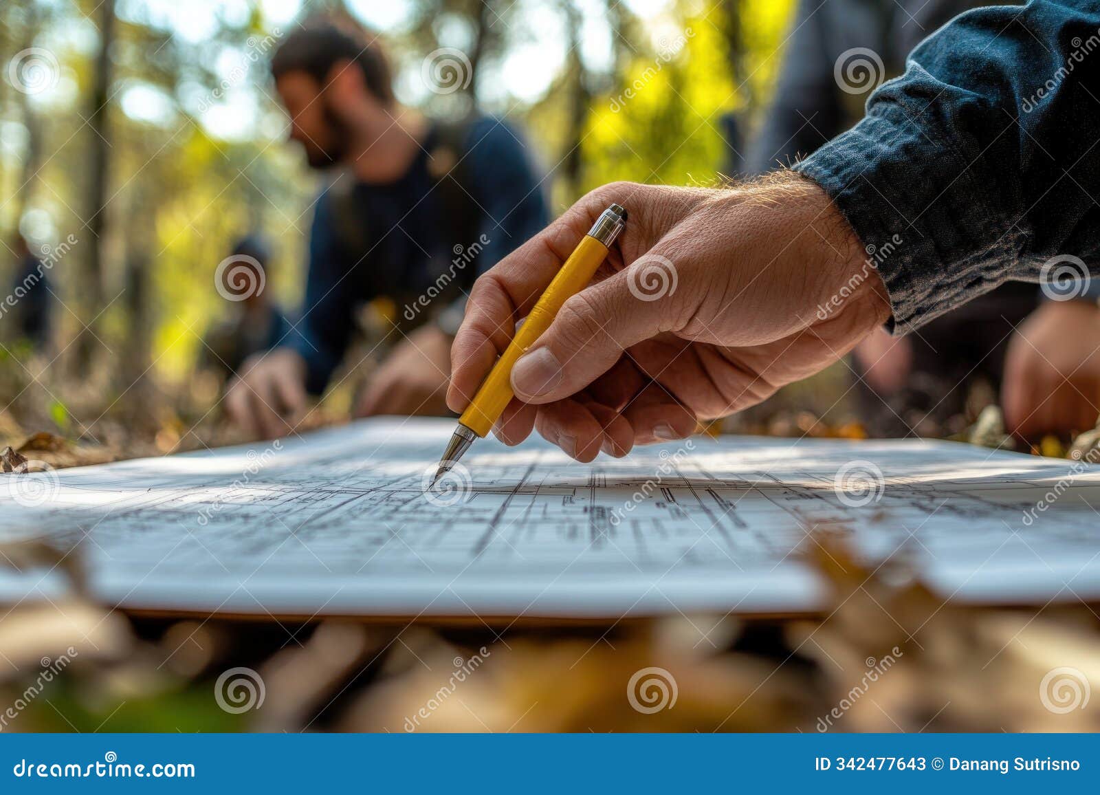 A Hand Points at a Grid on a Map, Likely for Surveying or Mapping the ...
