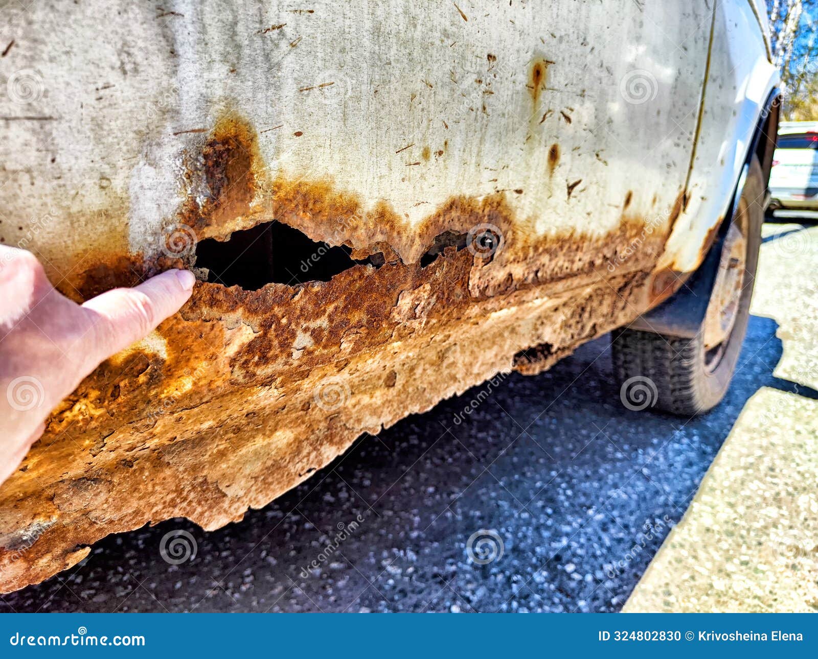 A Hand Points at Rust Damage on a Cars Body Panel Stock Photo - Image ...