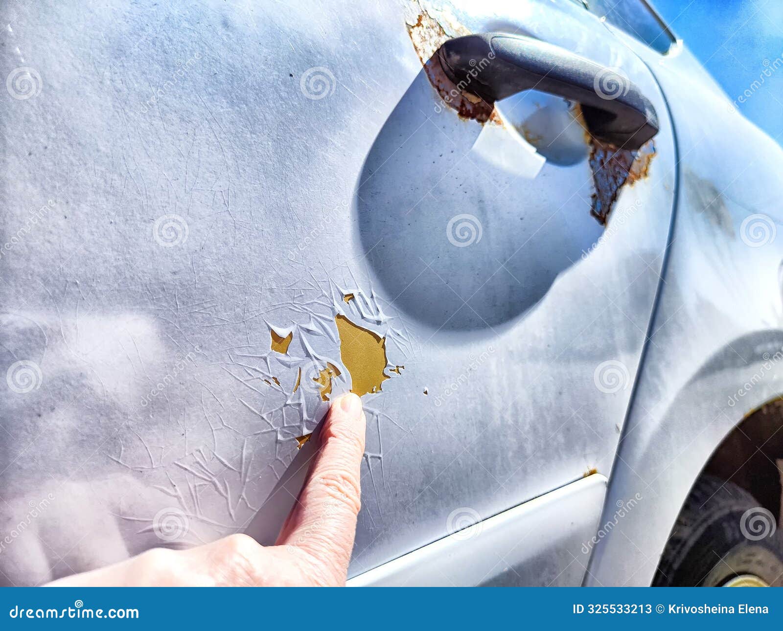 A Hand Points at Rust Damage on a Cars Body Panel Stock Image - Image ...