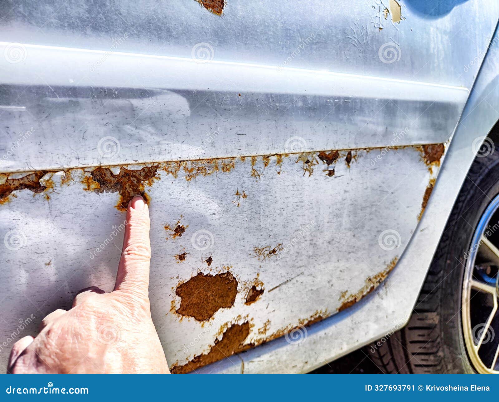 A Hand Points at Rust Damage on a Cars Body Panel Stock Image - Image ...