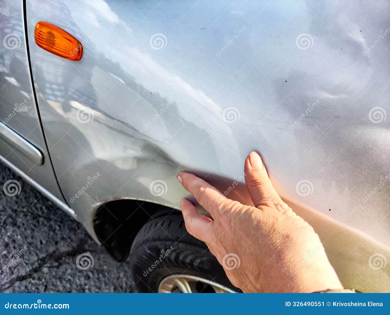 A Hand Points To a Dent on a Silver Car Door Stock Image - Image of ...