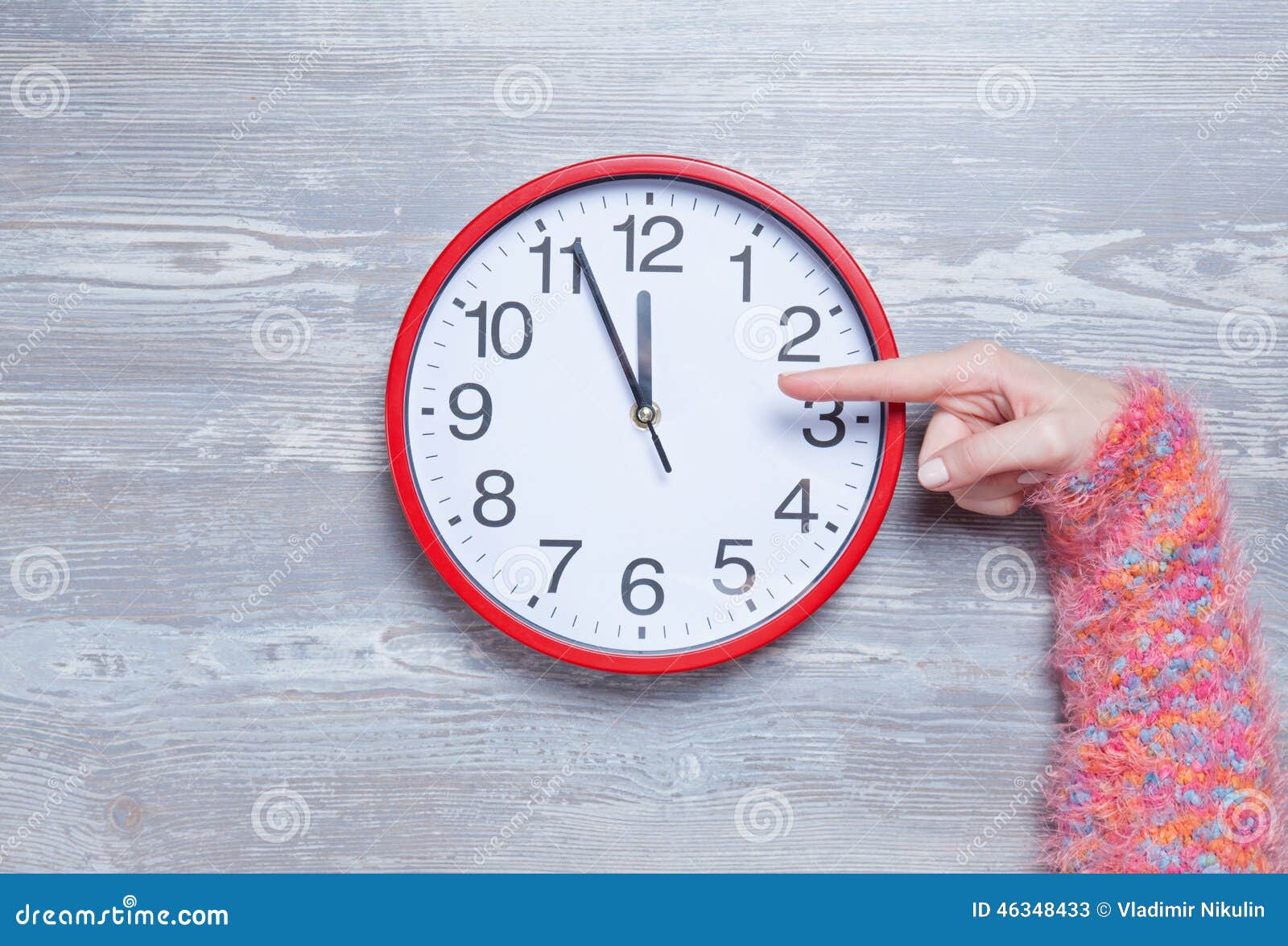 Hand poiting on a clock stock image. Image of school - 46348433
