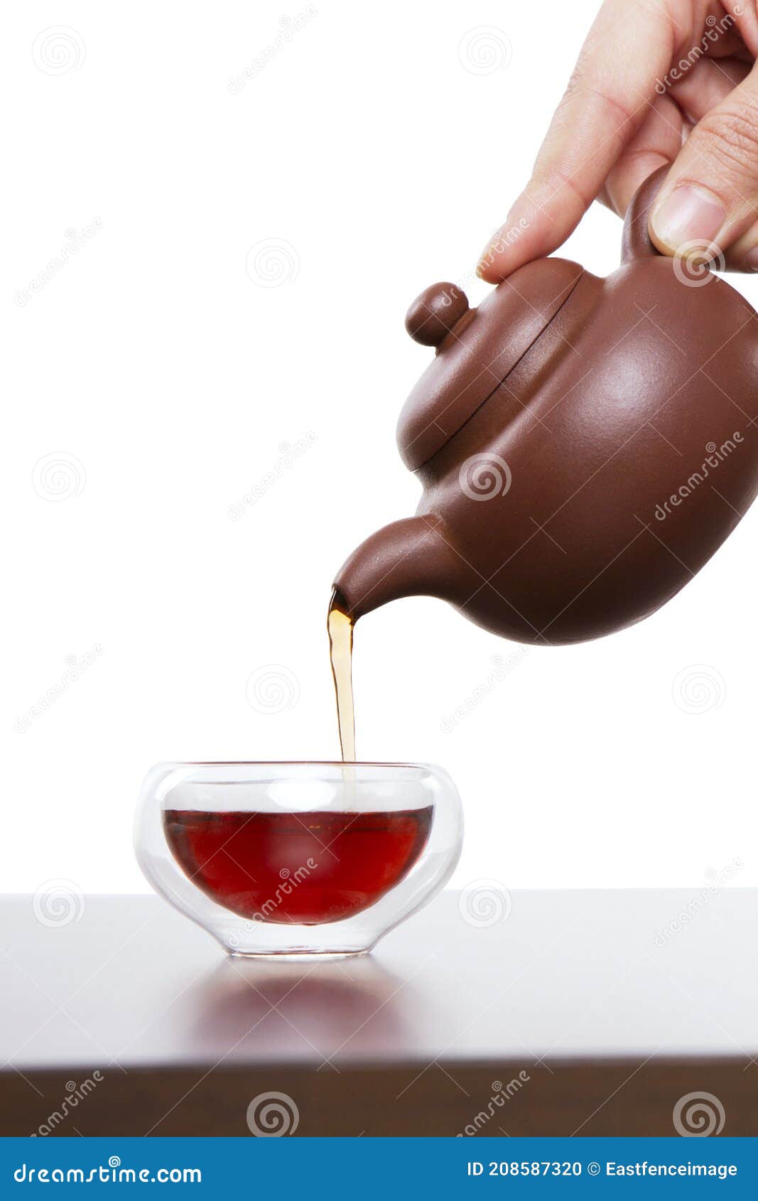A Hand in Pouring Tea Closeup Stock Photo - Image of females, woman ...