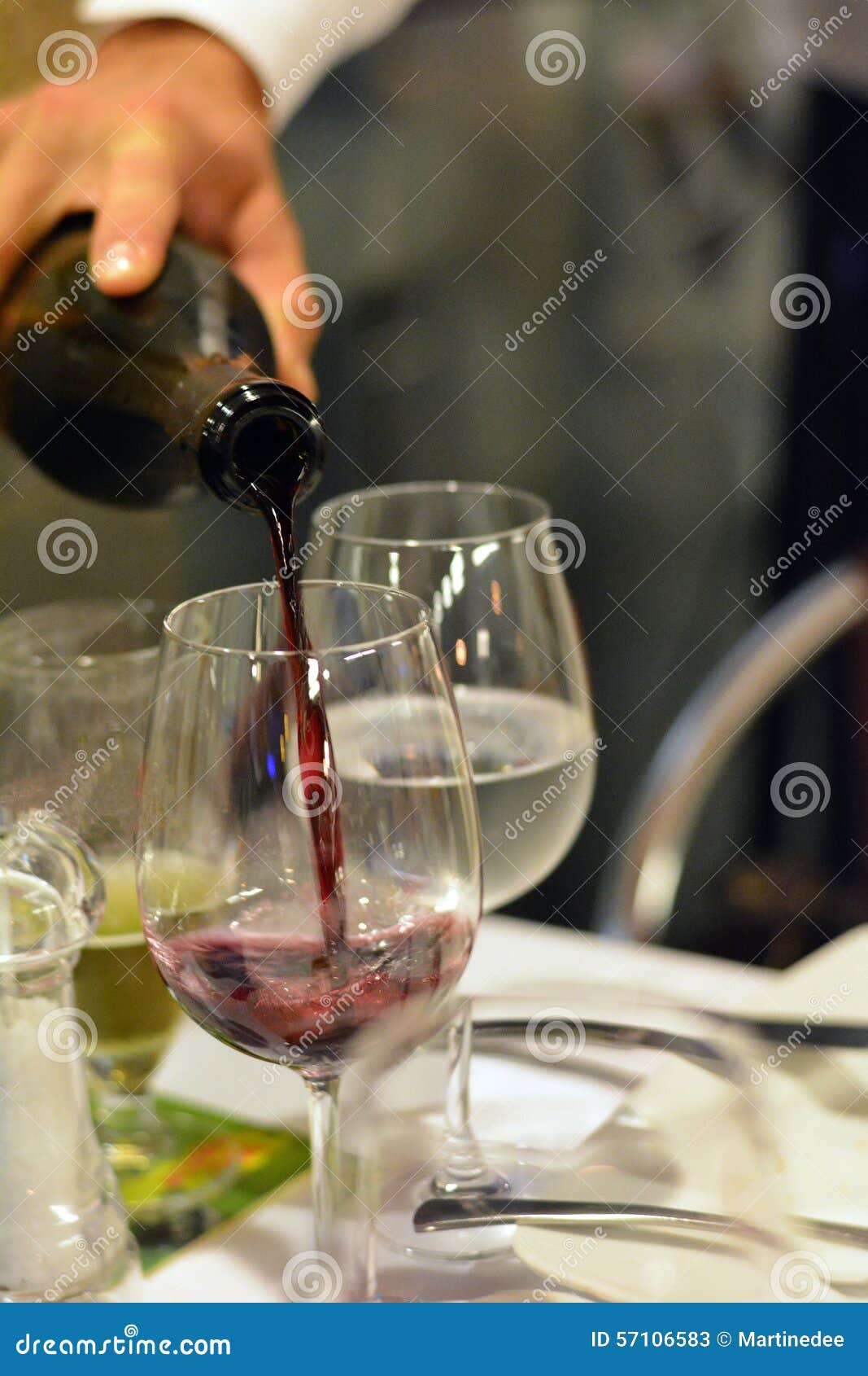 Hand Pouring Red Wine from Bottle into a Glass Stock Image - Image of ...