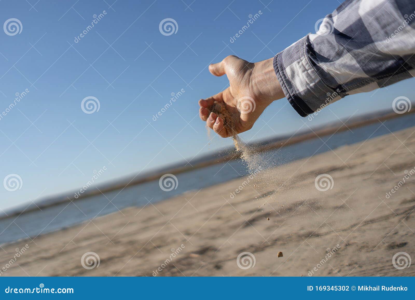 Hand Pouring the Sand on the Beach As the Symbol of Disappointment and ...