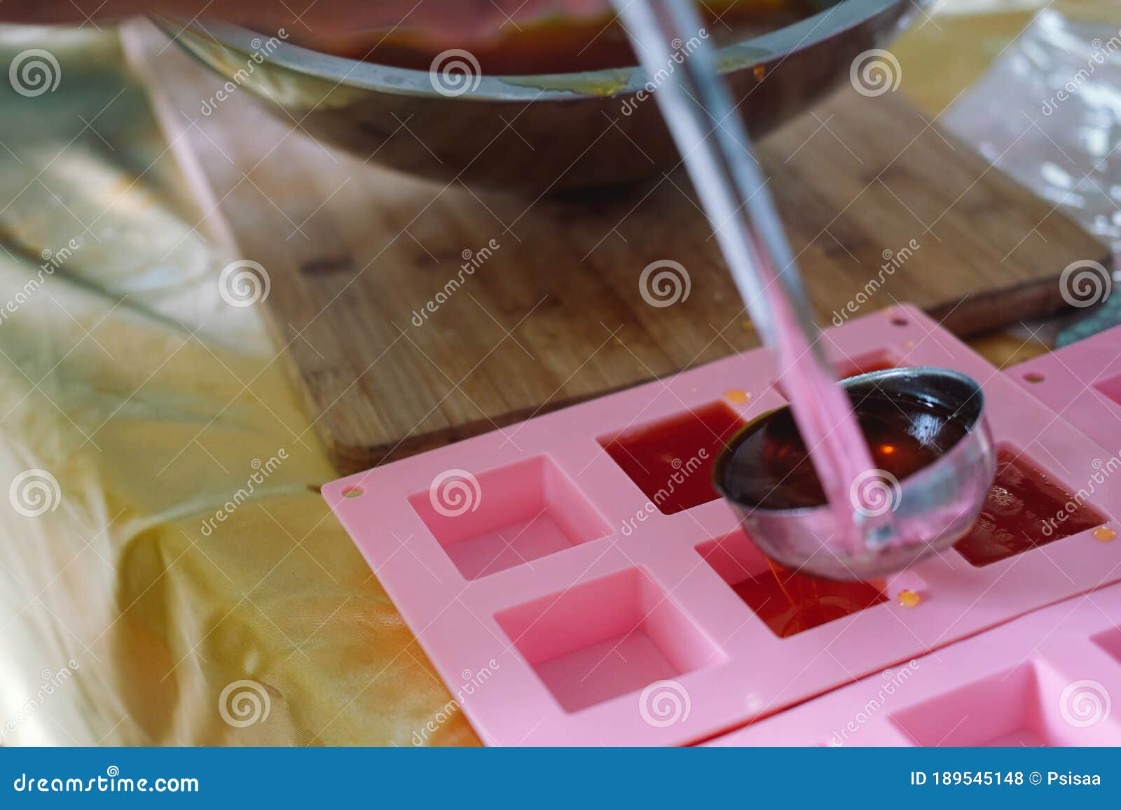 Hand Pouring Soap Mixture on Plastic Form Stock Photo - Image of hand ...
