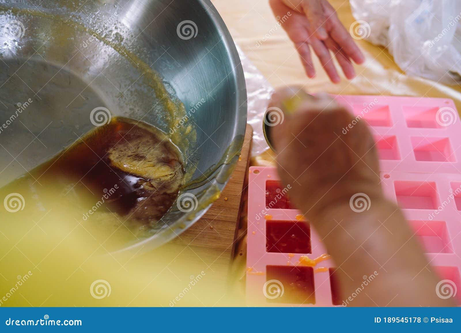 Hand Pouring Soap Mixture on Plastic Form Stock Photo - Image of ...