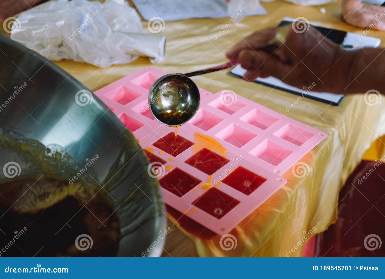 Hand Pouring Soap Mixture on Plastic Form Stock Image - Image of soap ...