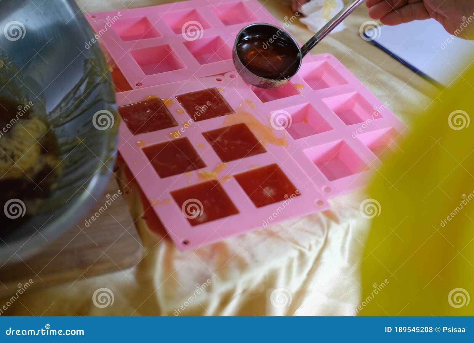 Hand Pouring Soap Mixture on Plastic Form Stock Photo - Image of ...