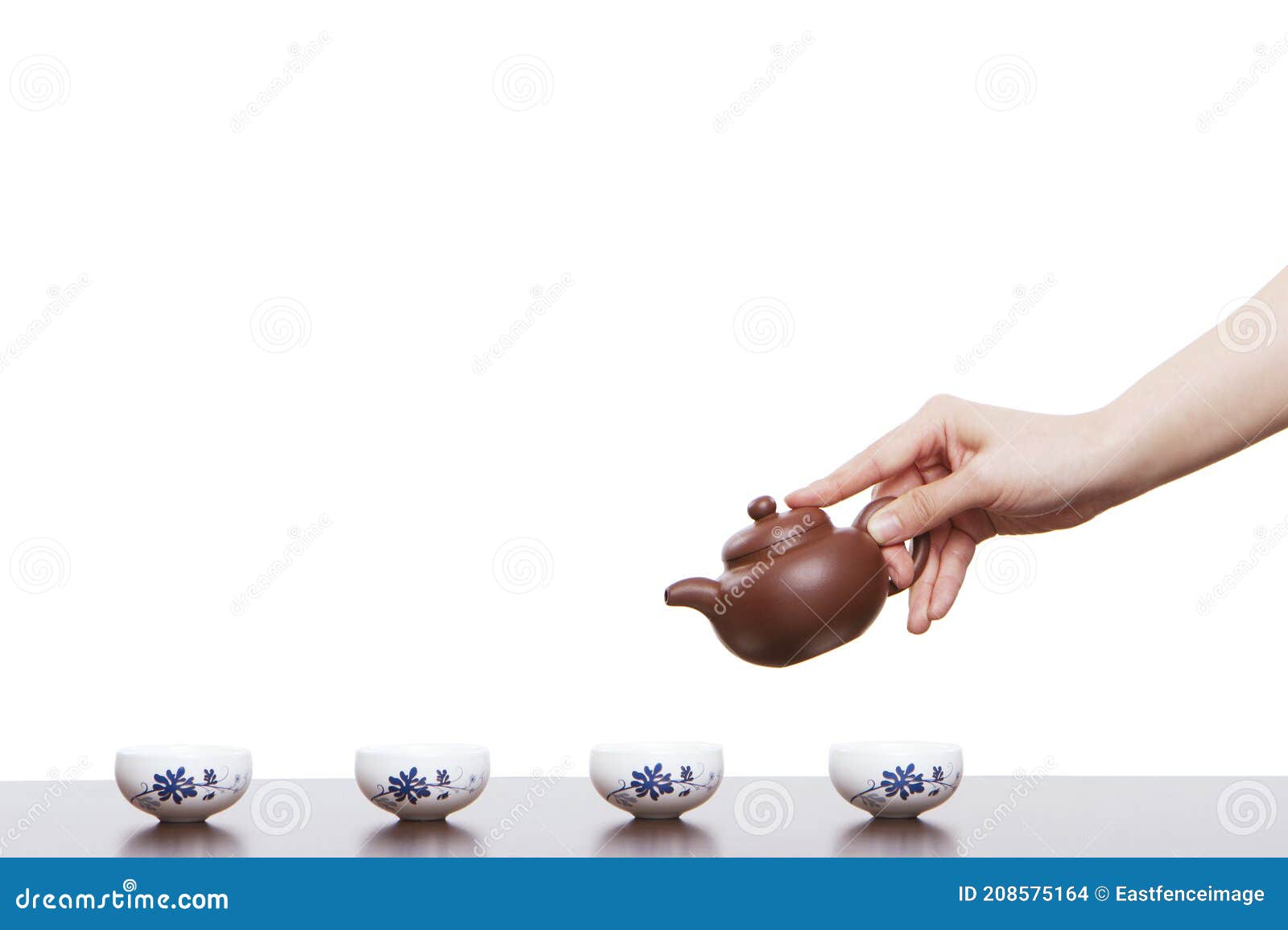A Hand in Pouring Tea Closeup Stock Photo - Image of container ...