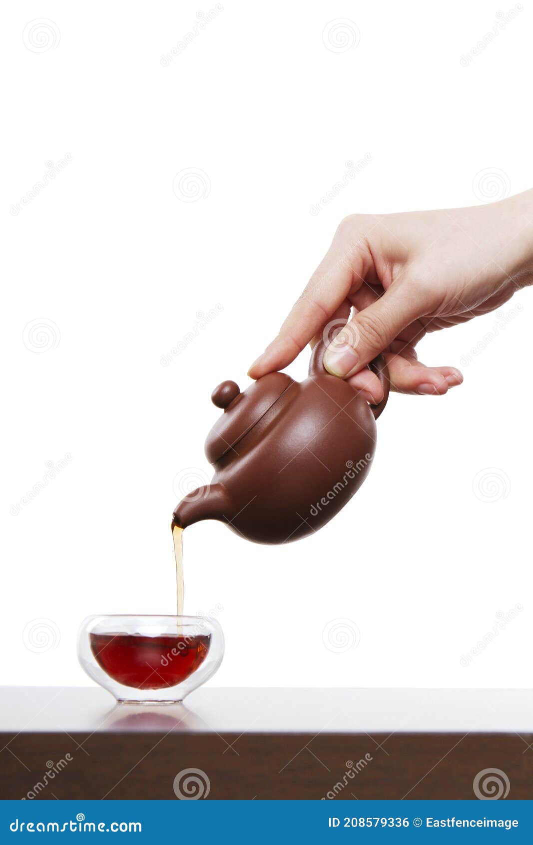 A Hand in Pouring Tea Closeup Stock Photo - Image of females, tradition ...
