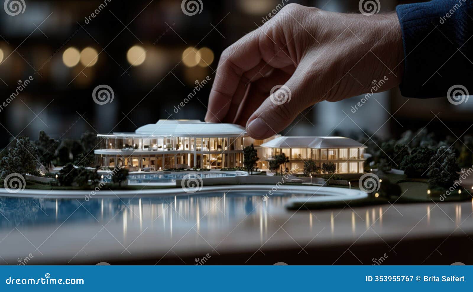 A Hand Presenting a Highly Detailed Model of a Luxury Home, with ...