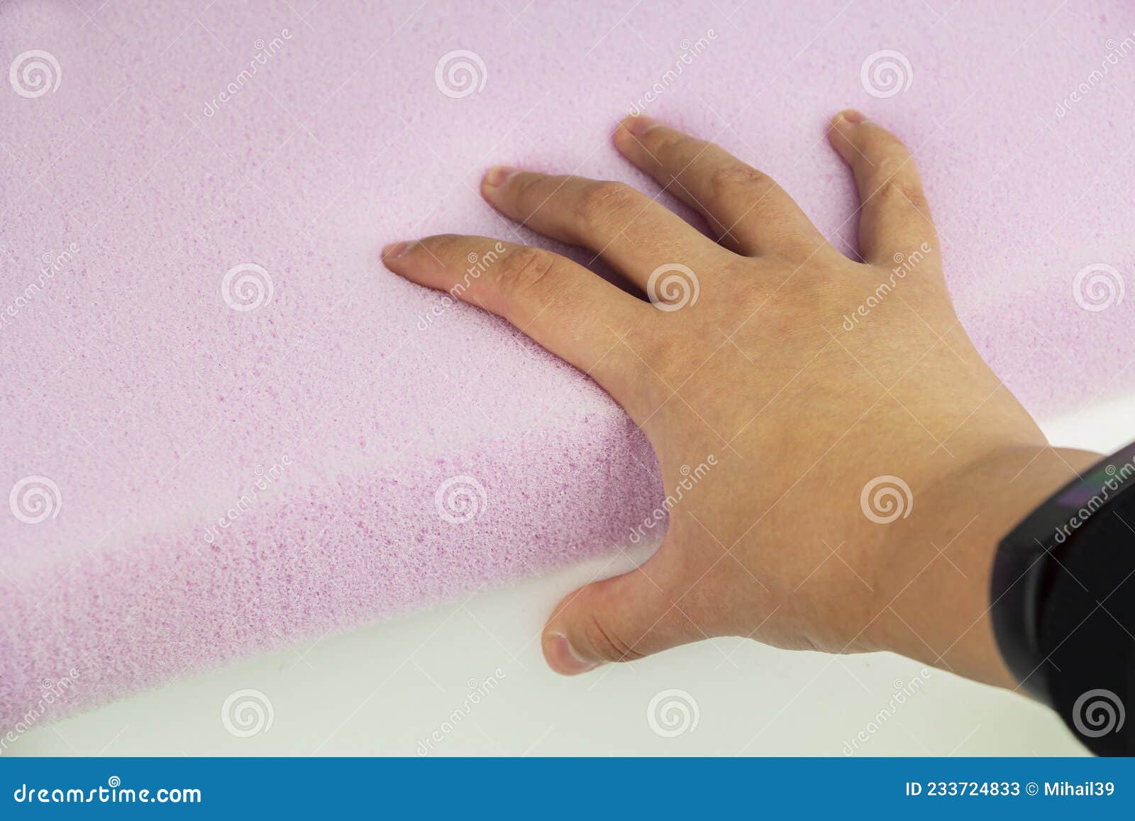 The Hand Presses on the Surface of the Rubber Foam. Checking Hardness ...