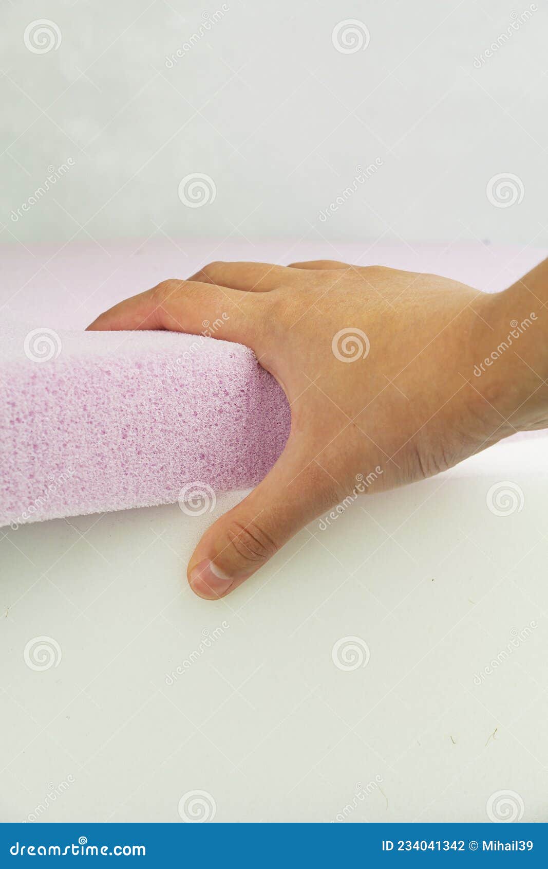 The Hand Presses on the Surface of the Rubber Foam. Checking Hardness ...