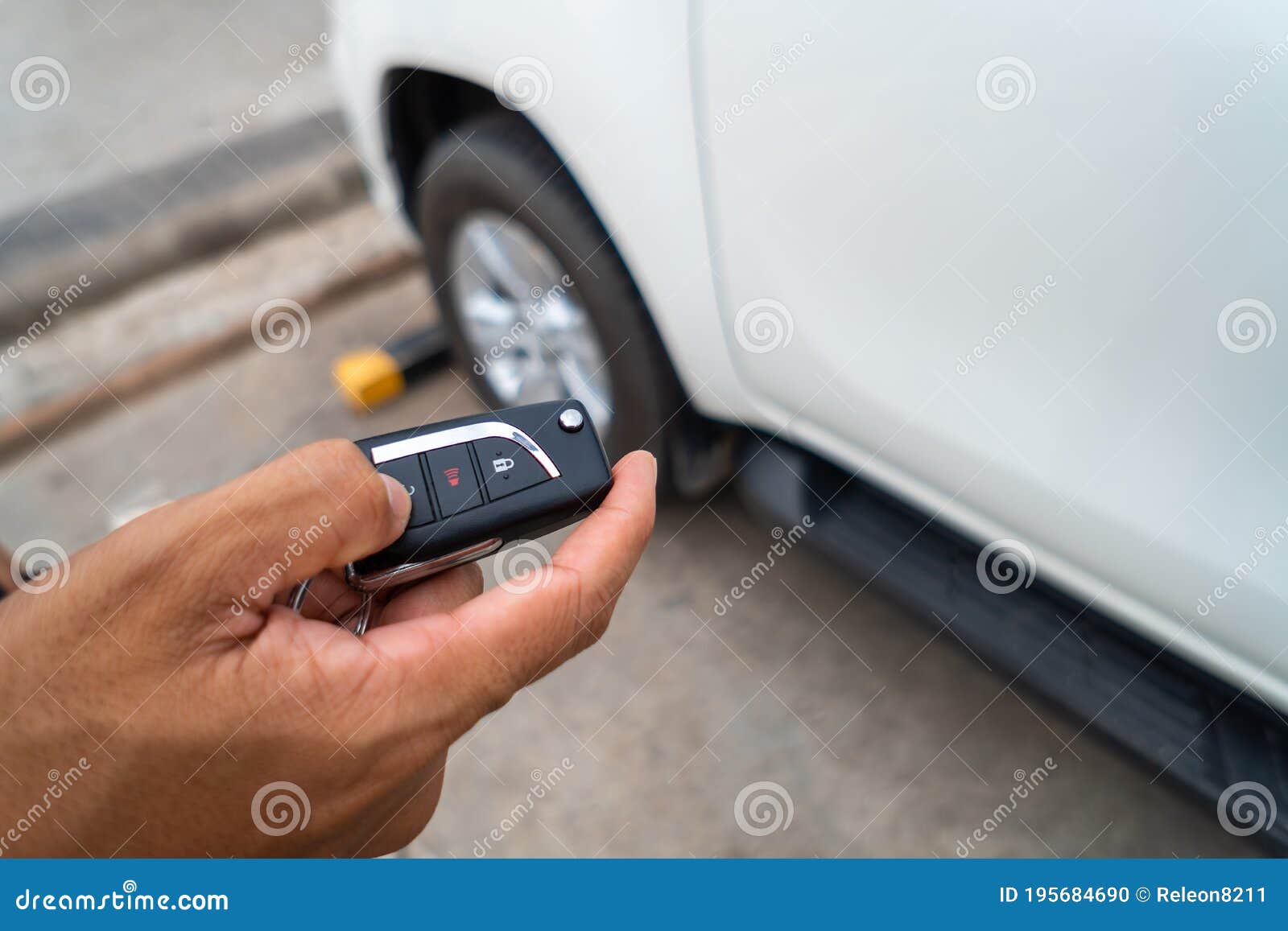 Hand Pressing the Button on the Remote To Lock or Unlock the Car Stock ...