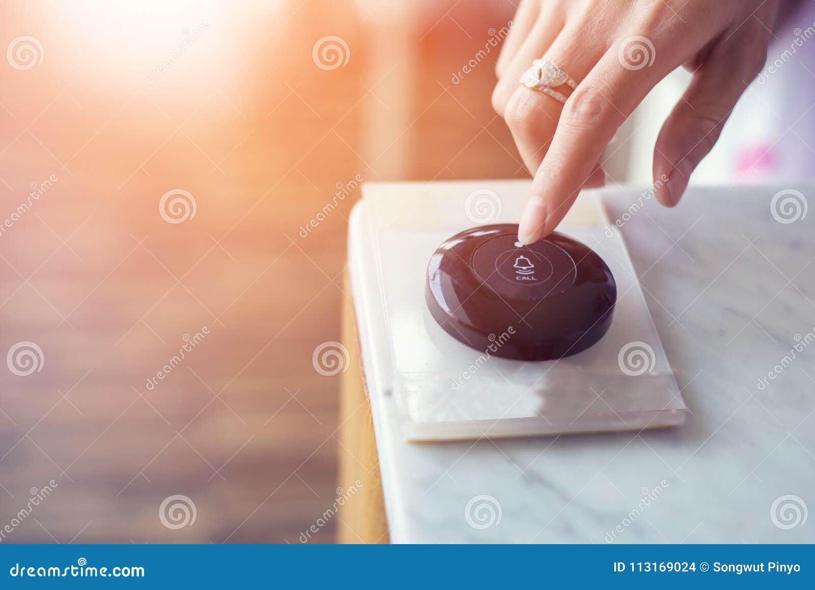 Hand Pressing the Call Button on Table Stock Photo - Image of button ...