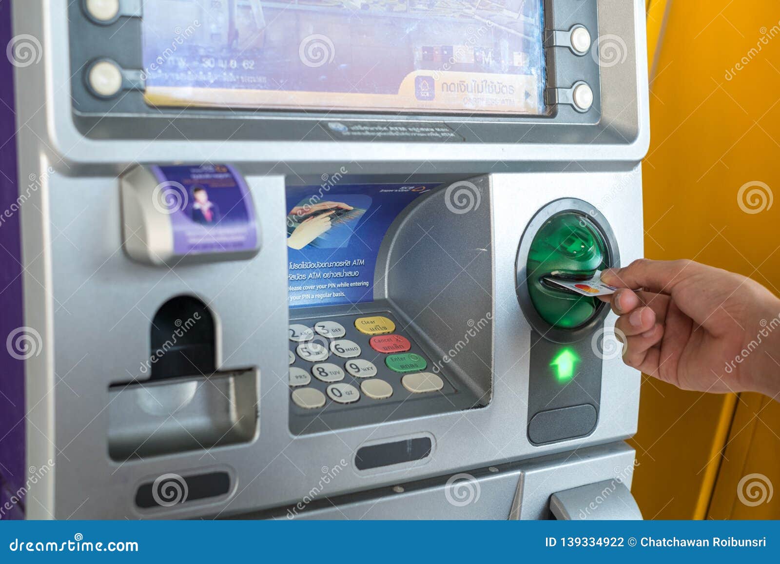 Hand Pressing the Code from the ATM Focuses on the Numbers and the ...