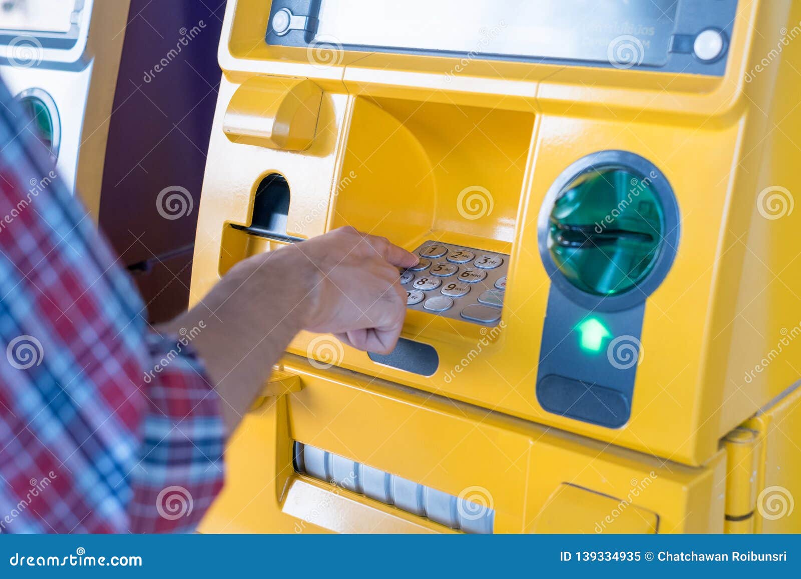 Hand Pressing the Code from the ATM Focuses on the Numbers and the ...