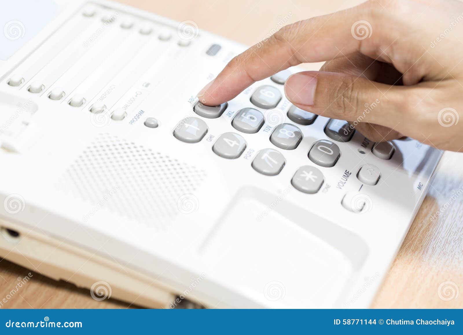 Hand pressing key on phone stock photo. Image of call - 58771144