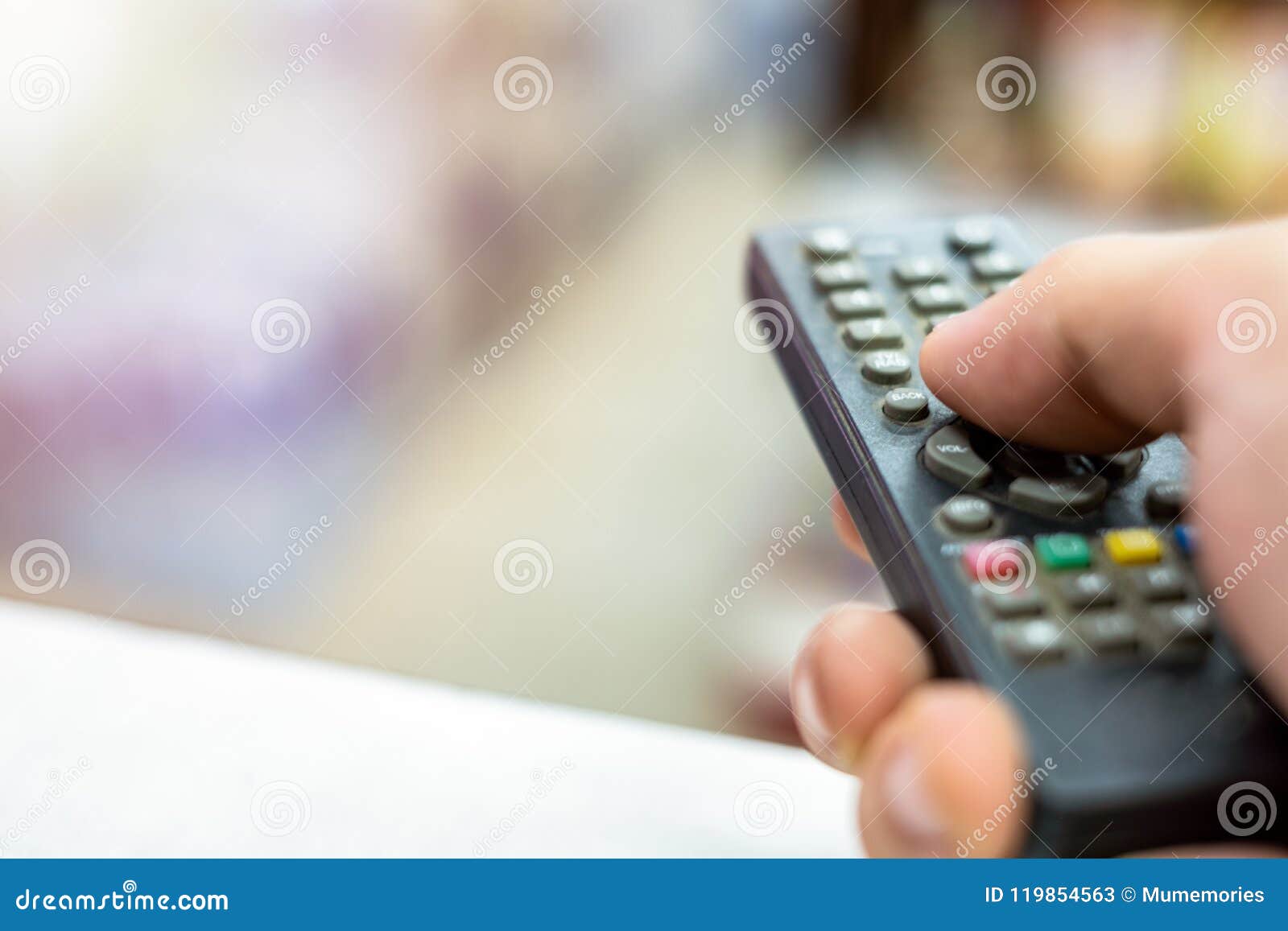 Hand Pressing Remote Control with Blur Scene Stock Image - Image of ...