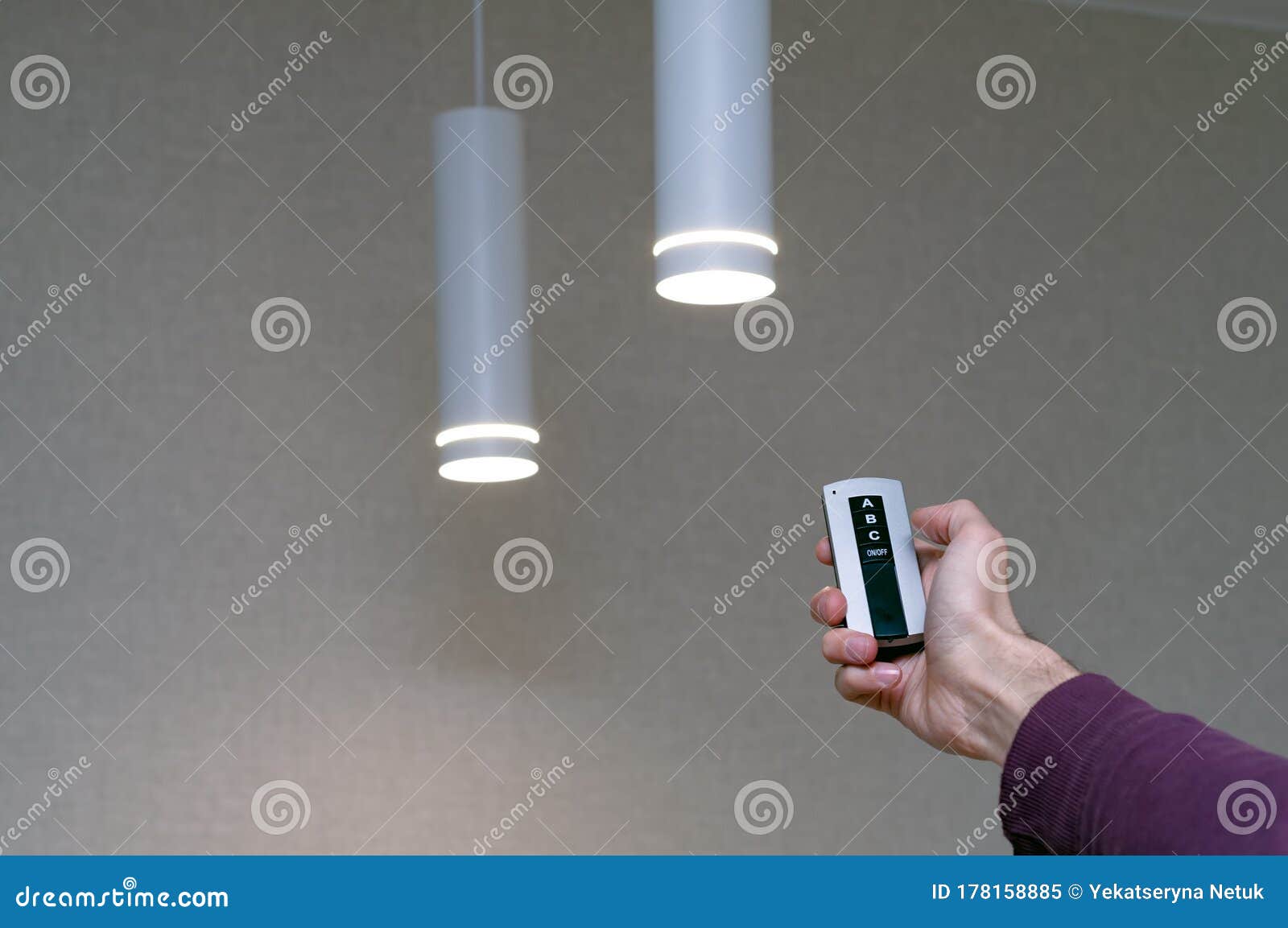 Hand Pressing a Remote Control Controlling an Light Stock Image - Image ...