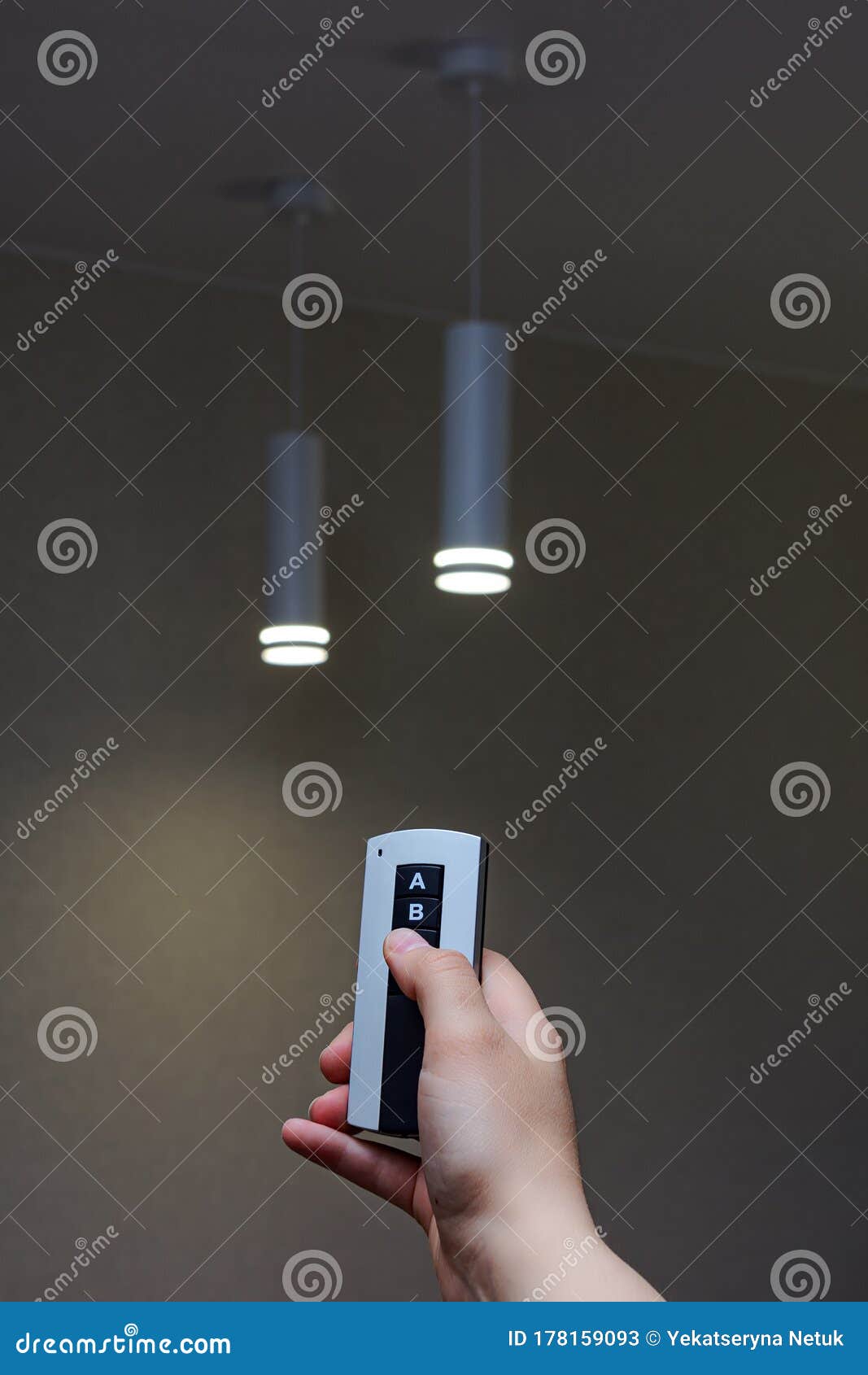 Hand Pressing a Remote Control Controlling an Light Stock Image - Image ...