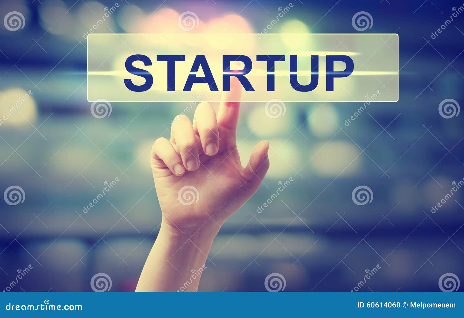 Hand Pressing a Startup Button on Blury City Lights Background Stock ...