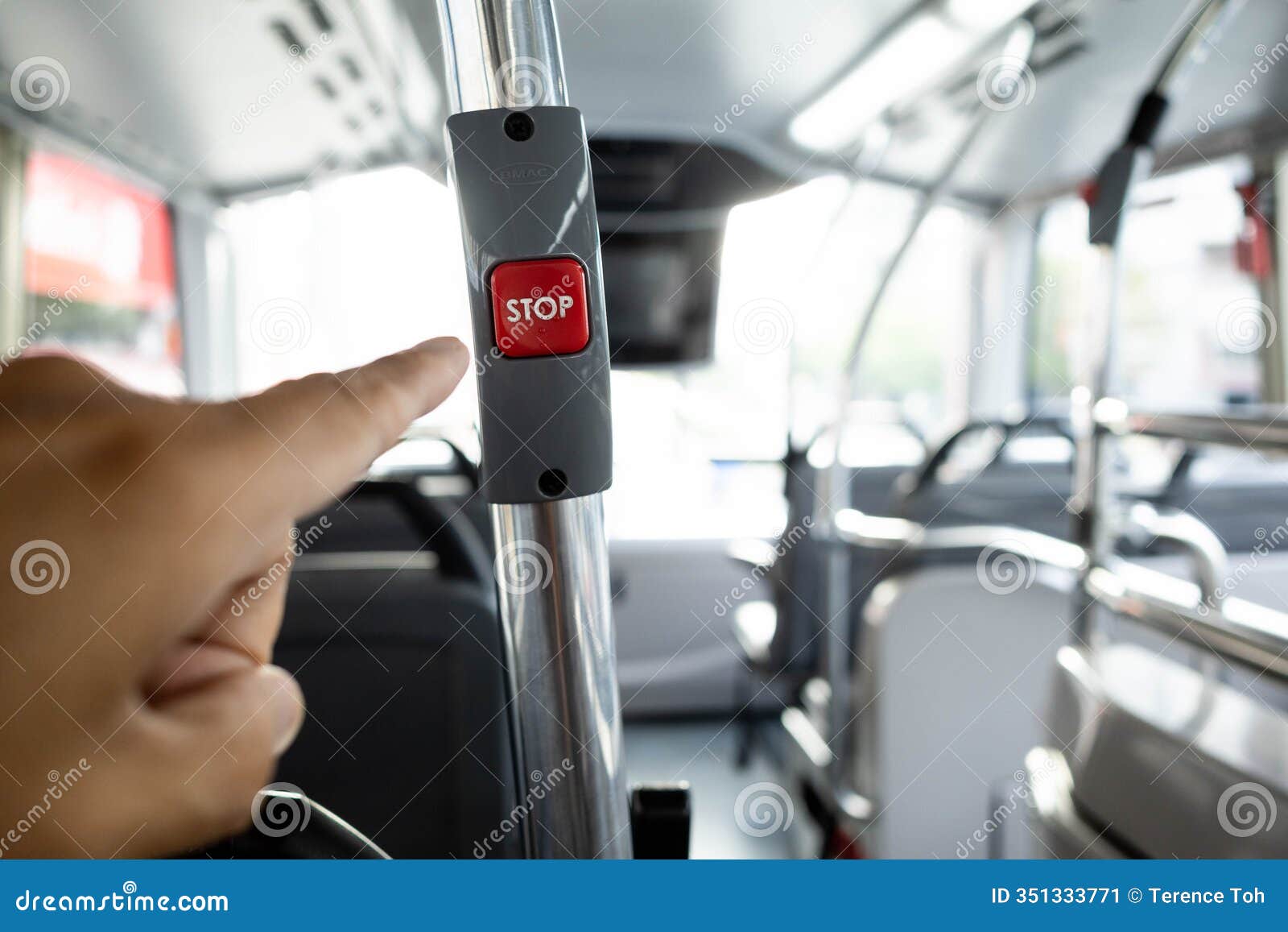 A Hand Pressing the Stop Button Inside a Public Bus Stock Image - Image ...