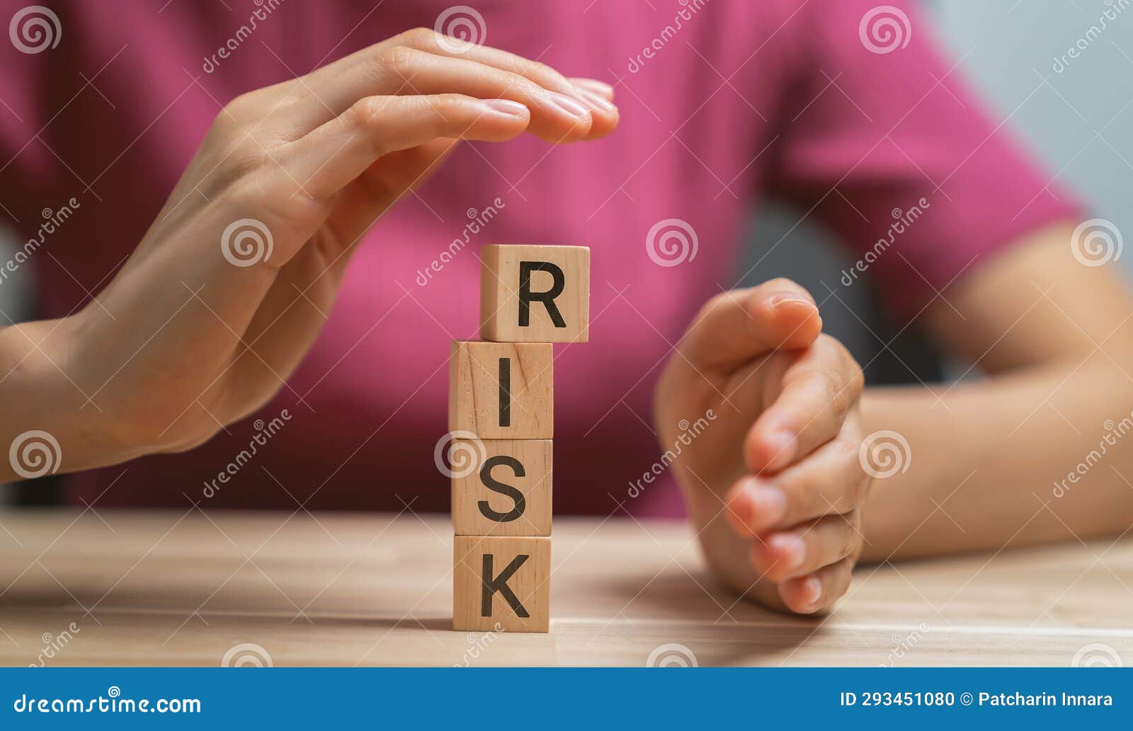 Hand Preventing Falling Wooden Blocks with Risk Word Stock Photo ...