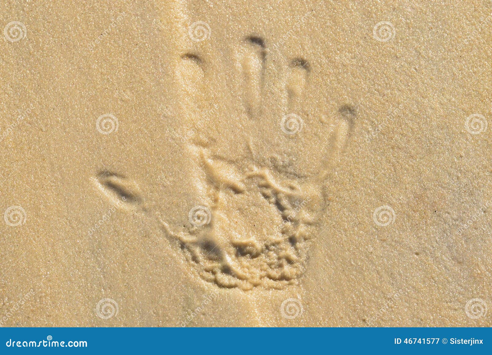Hand Print in the Sand stock image. Image of outline - 46741577