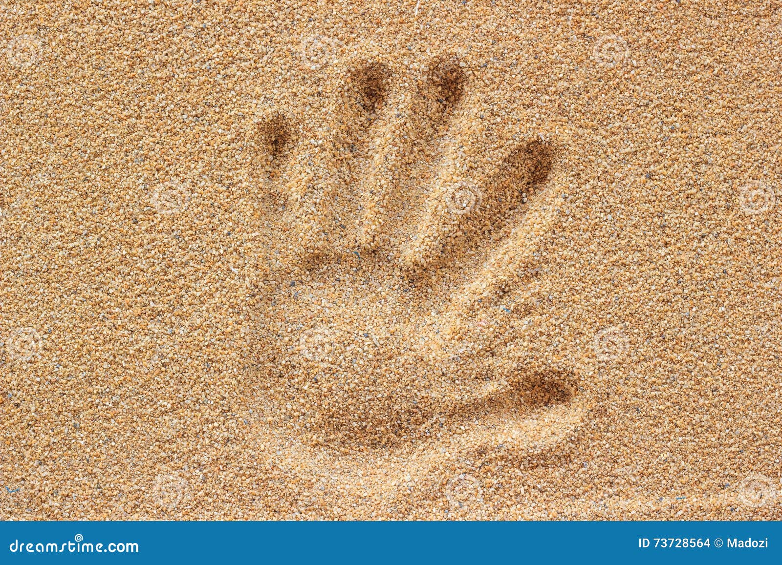 Hand prints on sand stock photo. Image of ocean, concept - 73728564