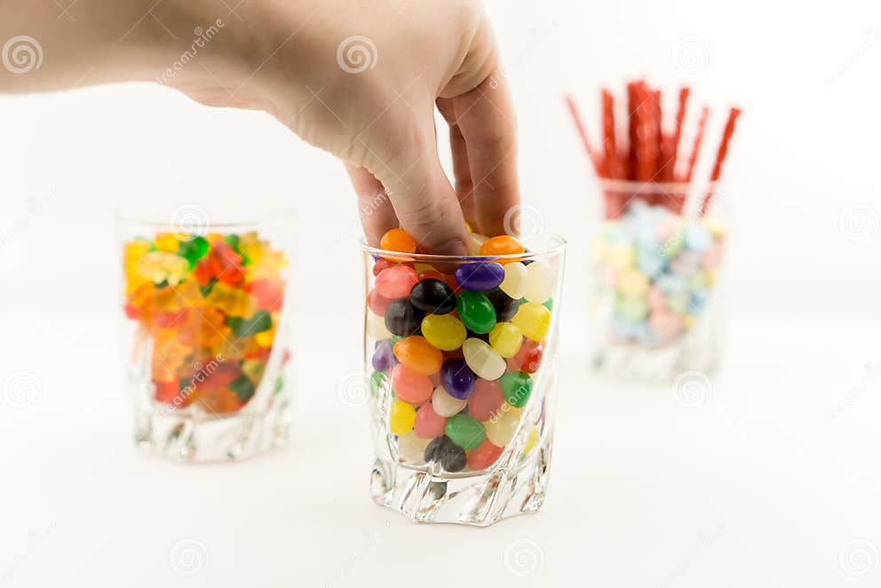Hand Pulling Candy from Jar Stock Photo - Image of twizzler, candy ...