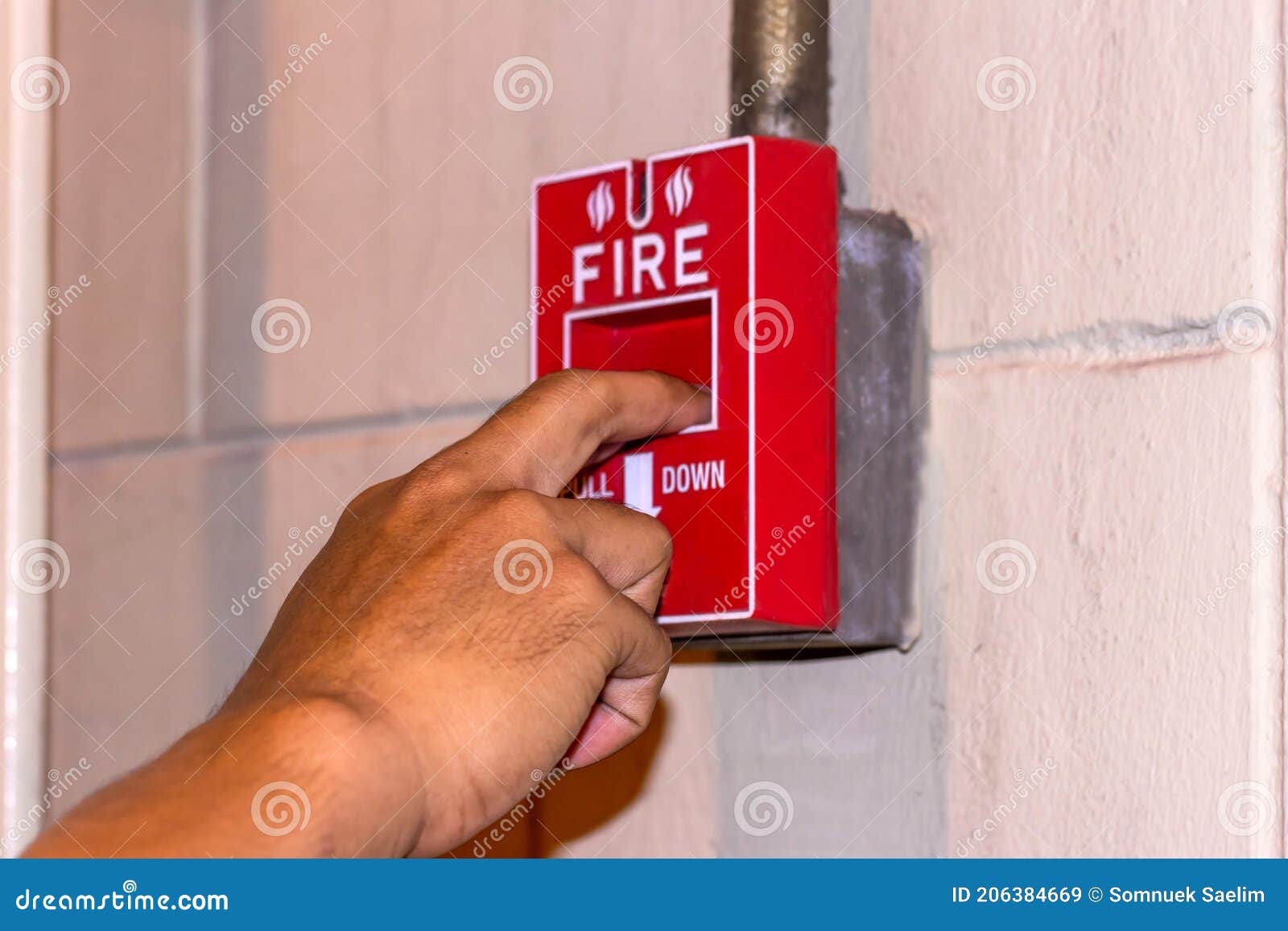 Hand Pulling Down the Manual Fire Alarm Station in Case of Fire ...