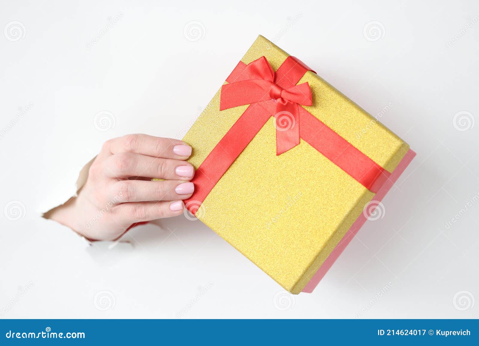 Hand Pulling Out Beautiful Gift from Torn Paper Stock Image - Image of ...