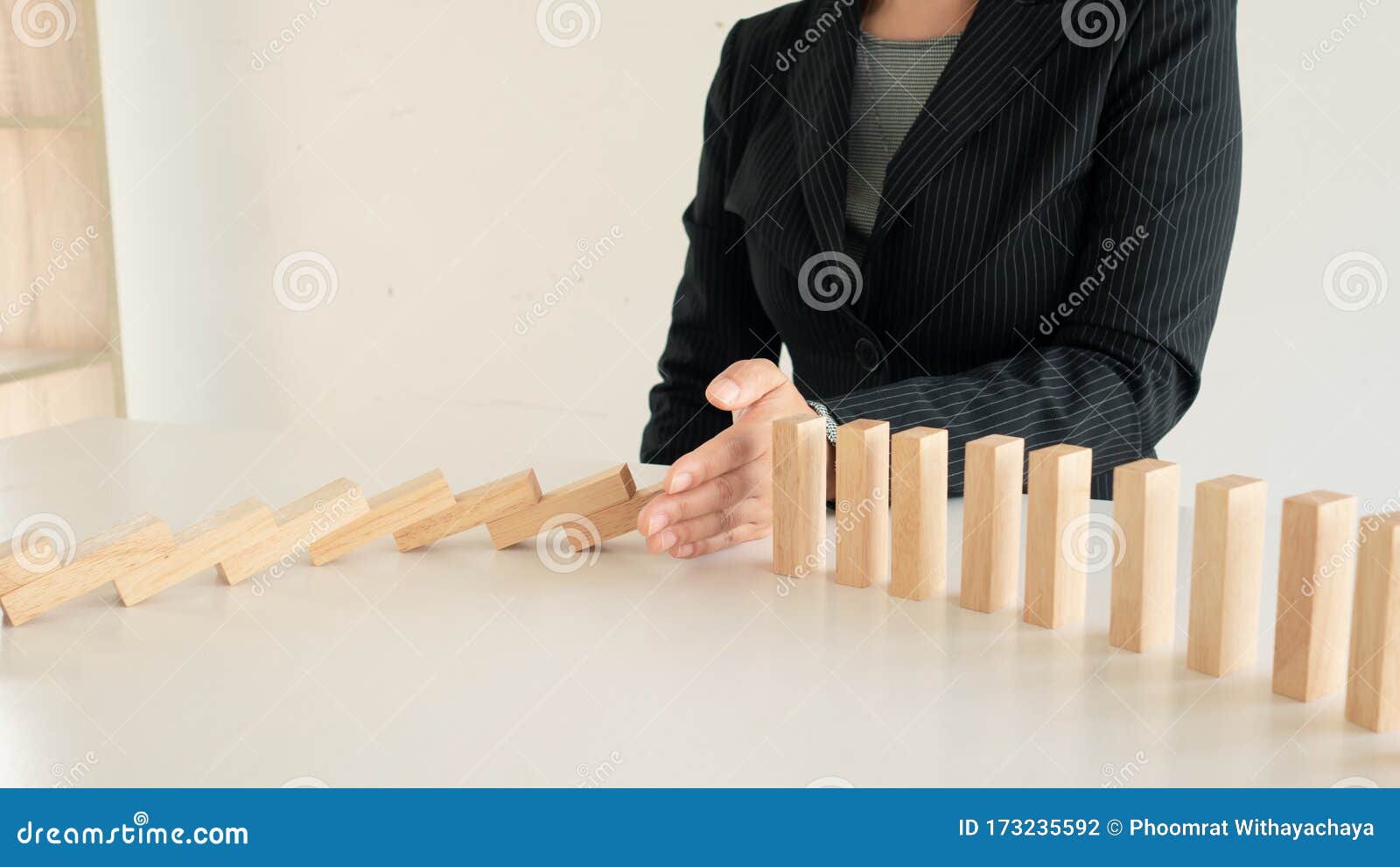 Hand Stopping Falling Wooden Blocks or Dominoes. Stock Photo - Image of ...