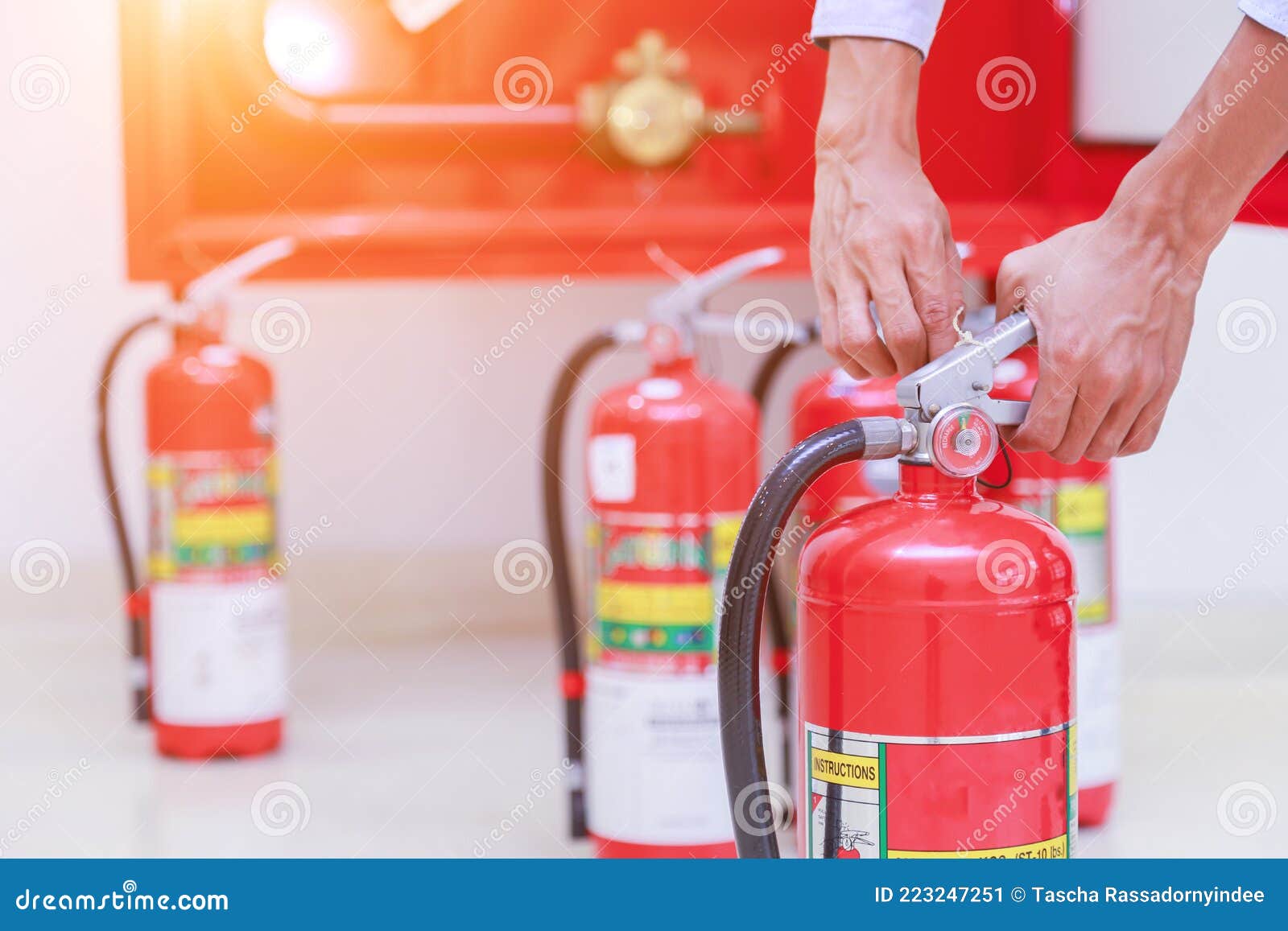Hand Pulling Safety Pin from Red Fire Extinguisher Stock Image - Image ...