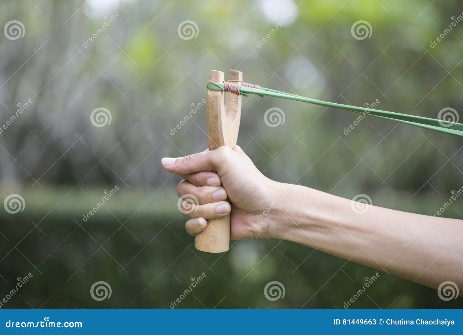 Hand Pulling Slingshot Preparing To Shoot a Goal Stock Image - Image of ...