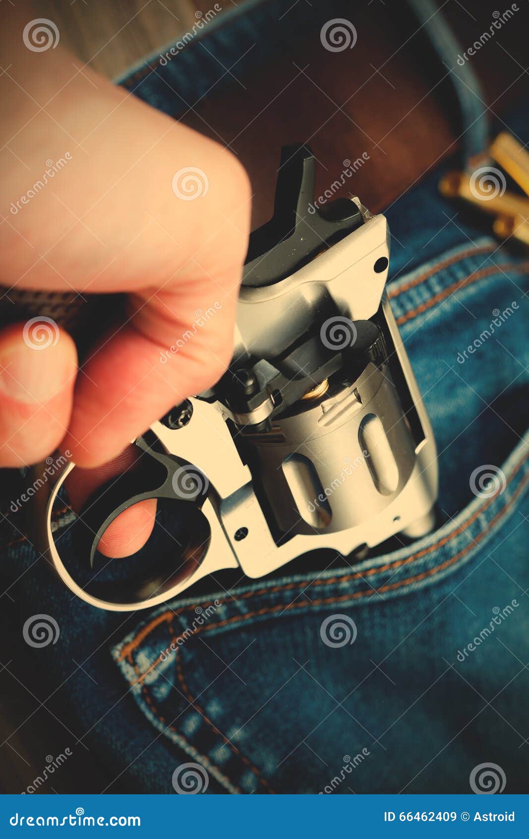 Hand Pulls Out a Revolver from the Pocket Stock Image - Image of ...