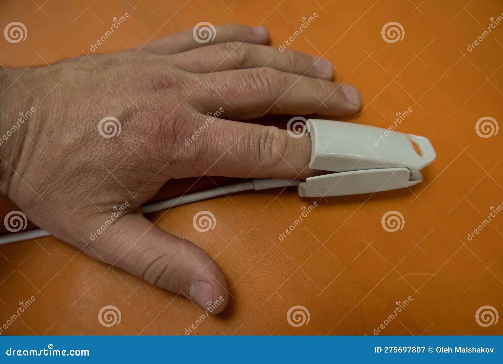 Hand with Pulse Oximeter on Orange Background Stock Image - Image of ...