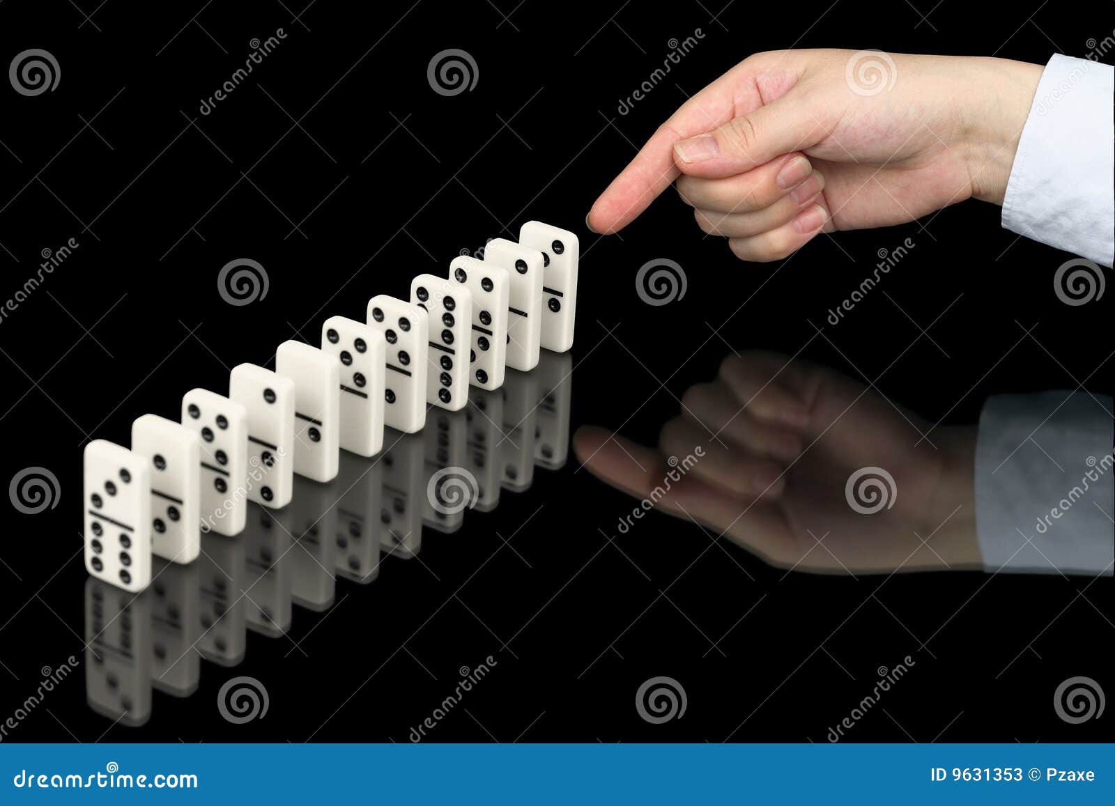 Hand Pushing Dominoes Counters on Black Stock Image - Image of incite ...