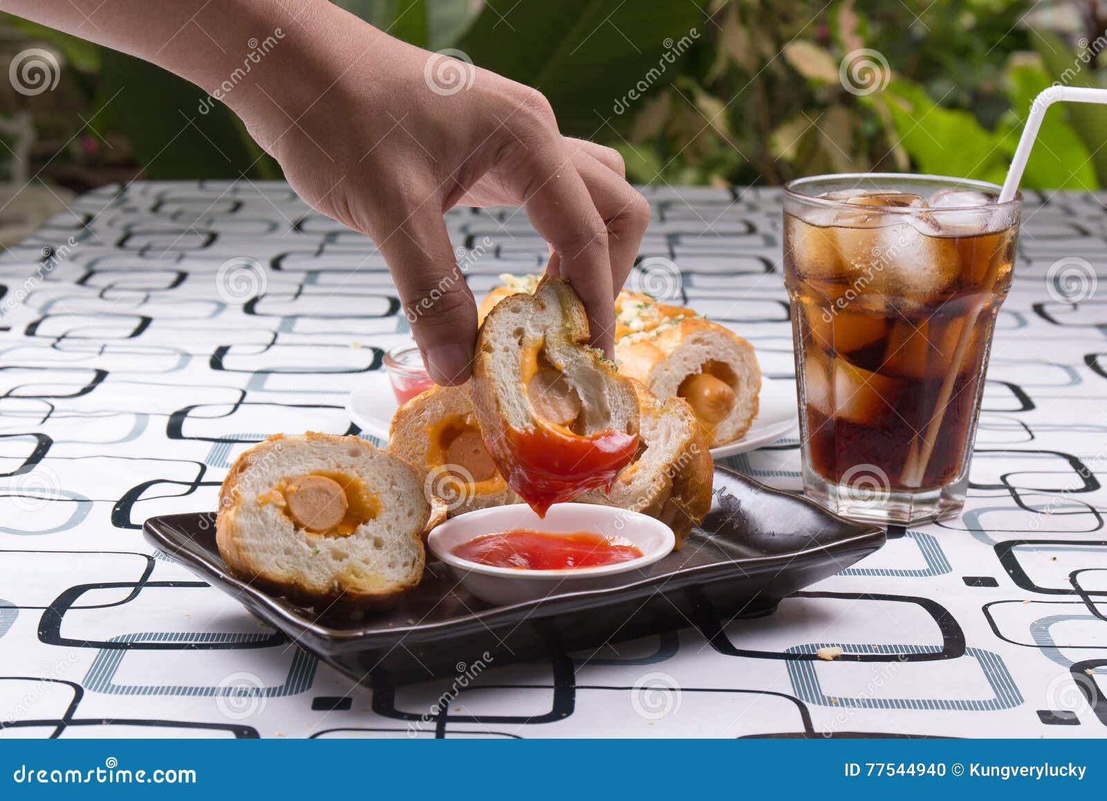 Hand Put Sausage Bread with Ketchup and Cola Drink Stock Photo - Image ...