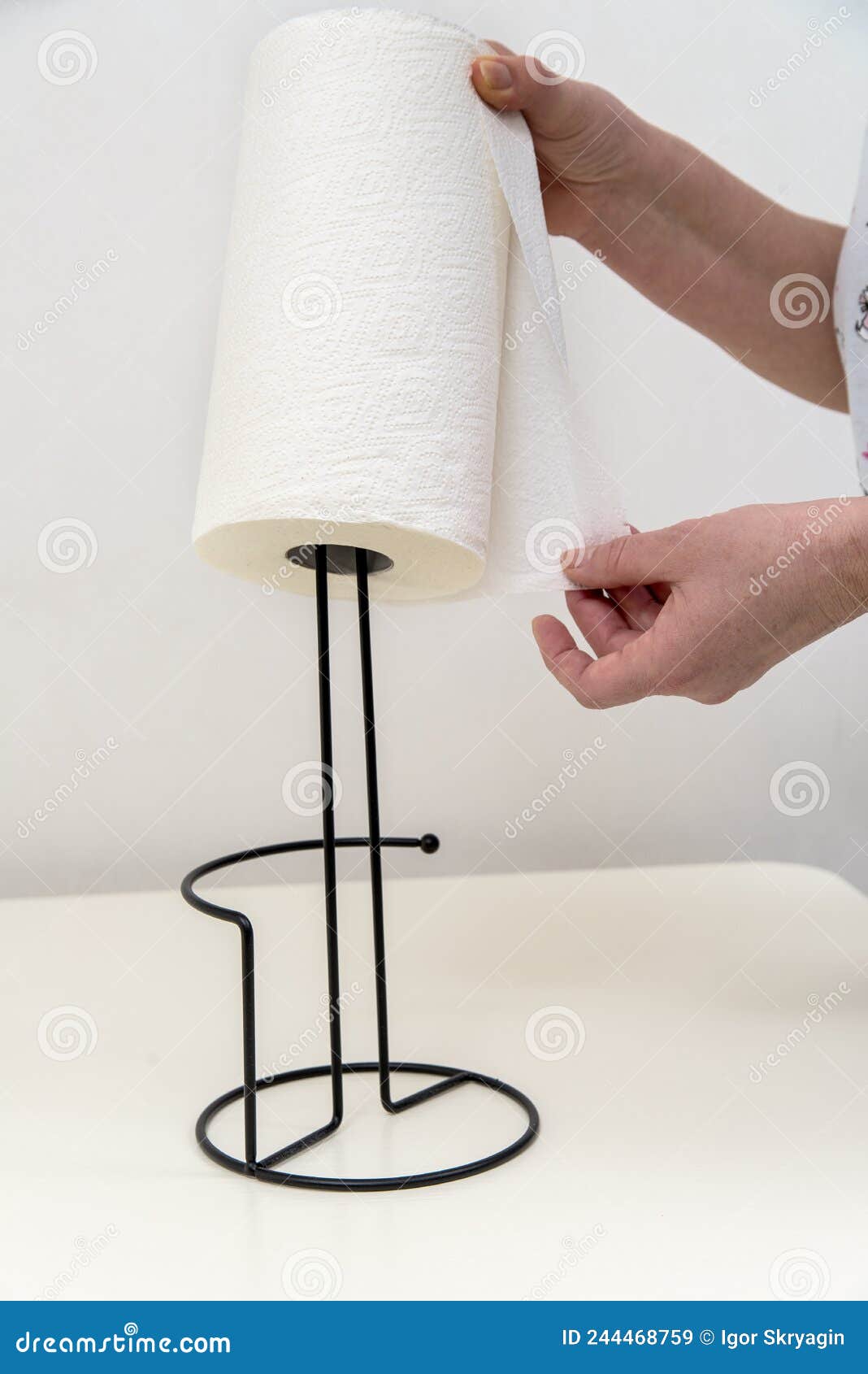 Hand Puts Paper Towel Roll on Metal Holder Stock Image - Image of metal ...