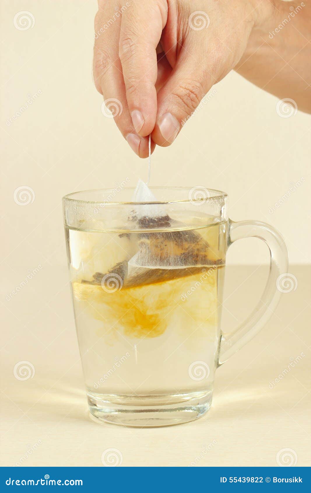 Hand Puts the Tea Bag in Cup of Water Stock Photo - Image of herbal ...