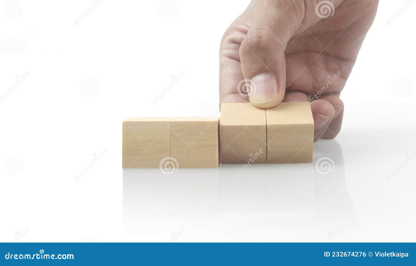 The Hand Puts Wooden Cube. Wooden Cubes Standing in Hand Stock Photo ...