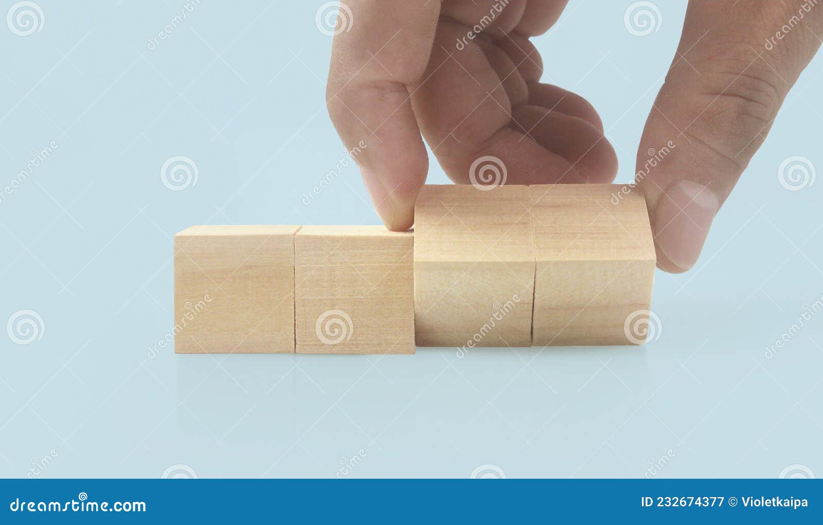 The Hand Puts Wooden Cube. Wooden Cubes Standing in Hand Stock Image ...