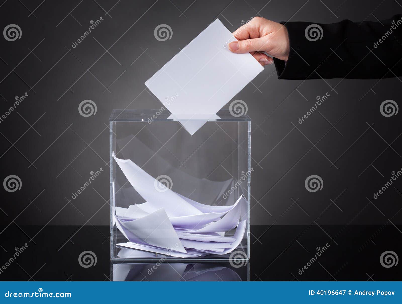Hand putting ballot in box stock image. Image of government - 40196647