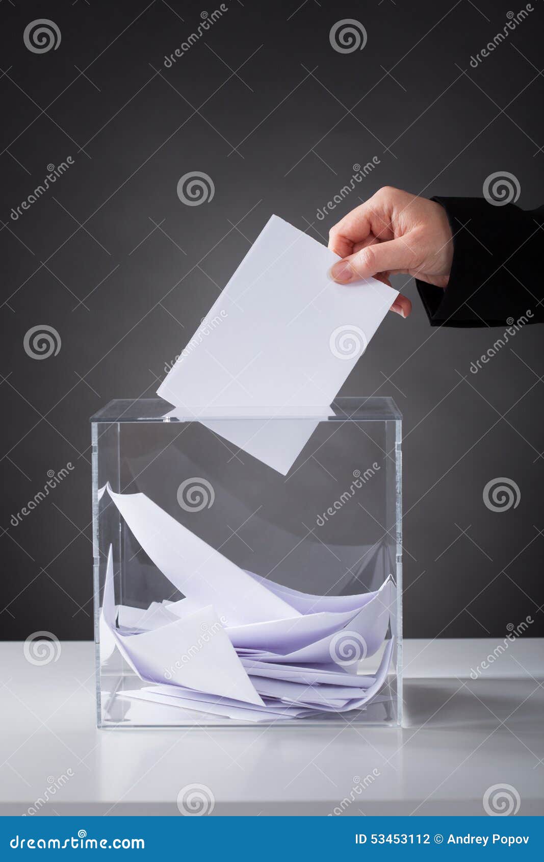 Hand putting ballot in box stock photo. Image of politics - 53453112
