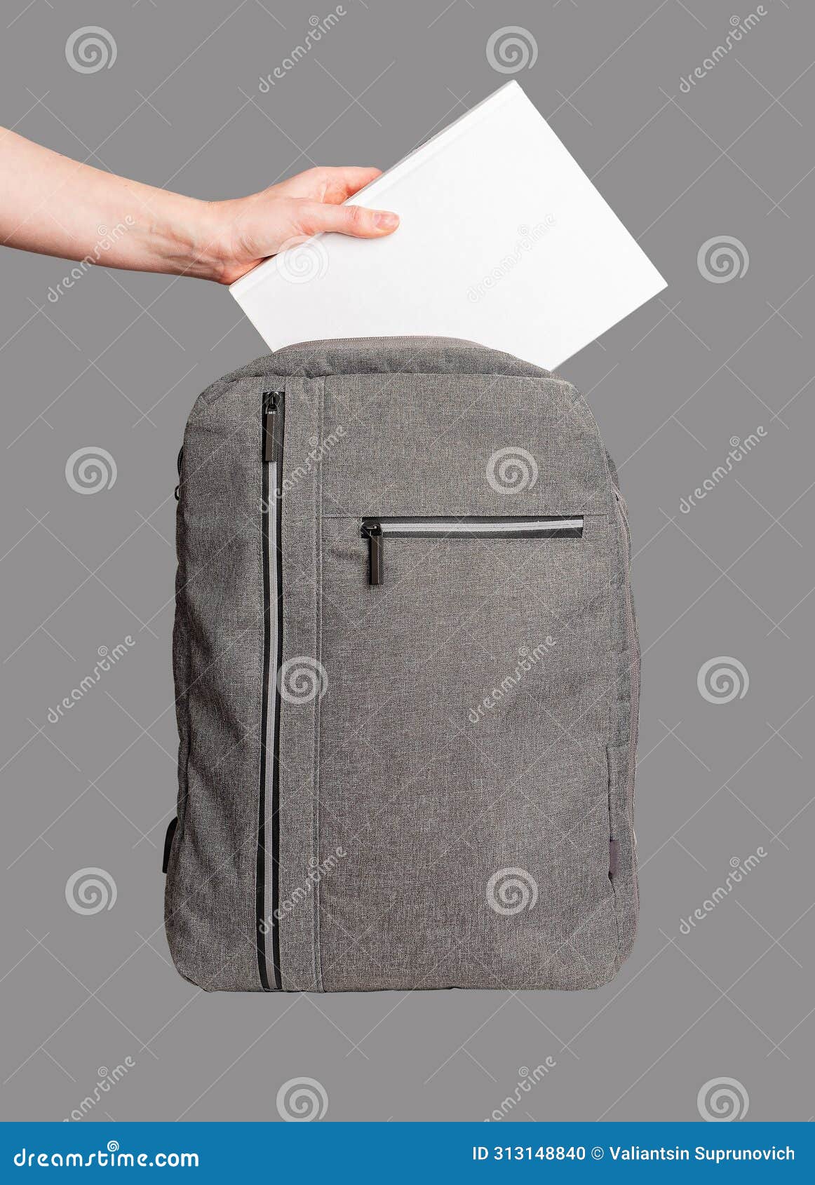 Hand Putting Blank Book into Backpack Stock Photo - Image of book ...