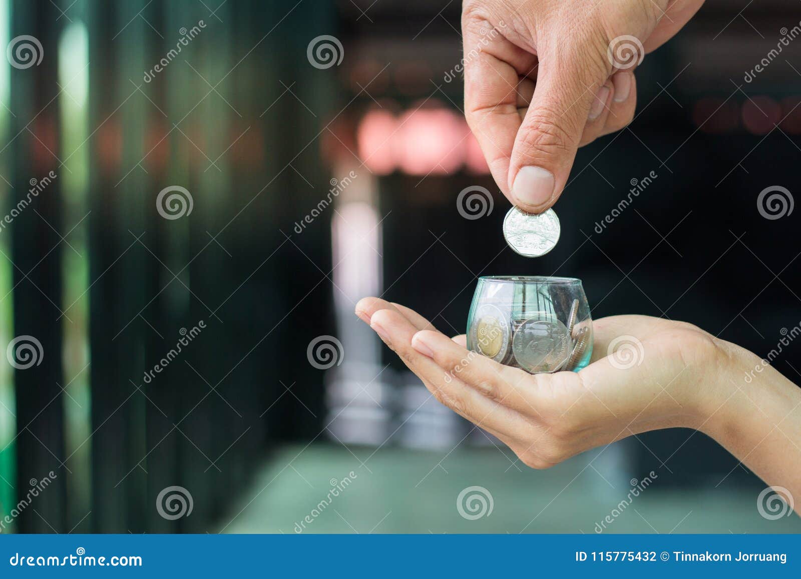 Hand Putting Coin into Glass Jar Stock Photo - Image of benefit, loan ...
